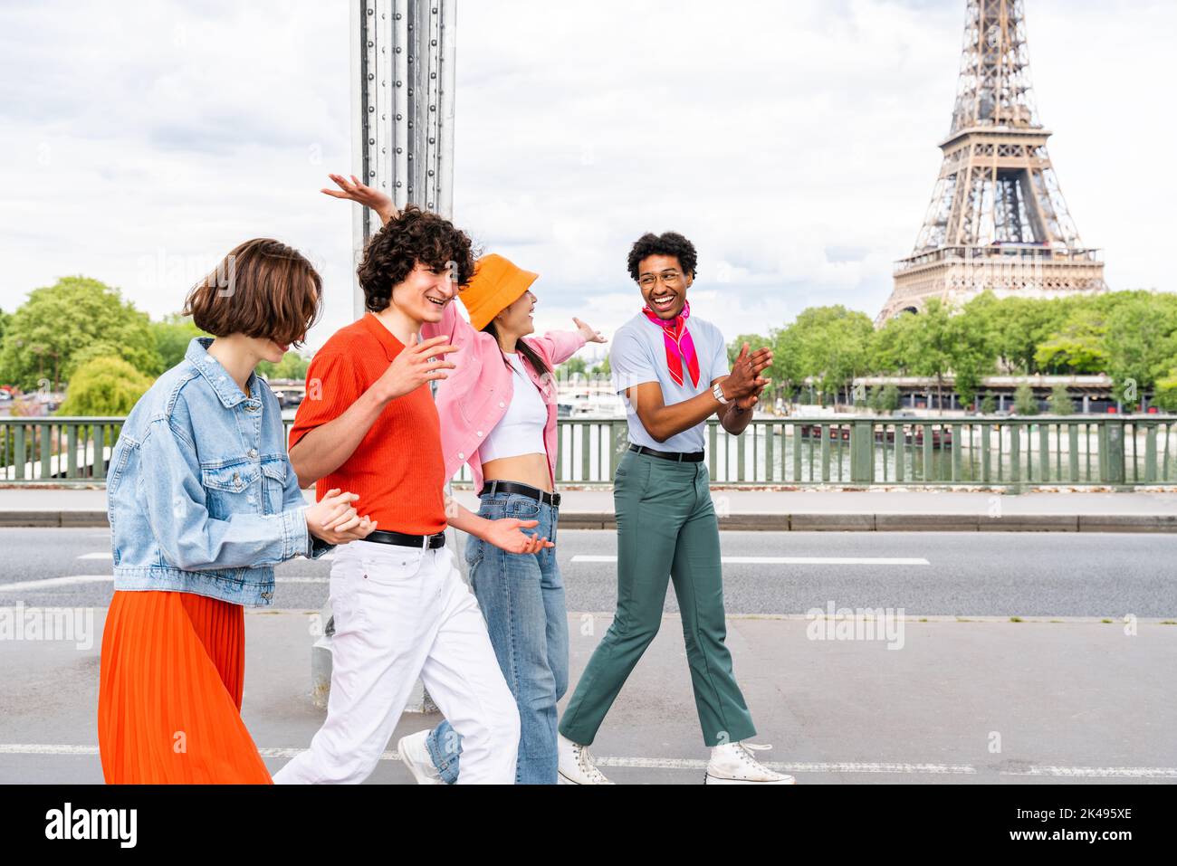 Group of young happy friends visiting Paris and Eiffel Tower, Trocadero ...