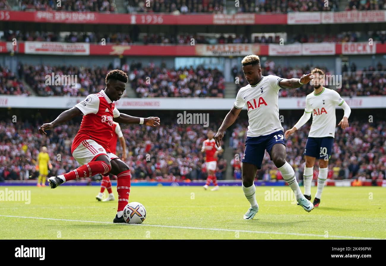 Arsenal's Bukayo Saka and Tottenham Hotspur's Ryan Sessegnon (right) during the Premier League ...