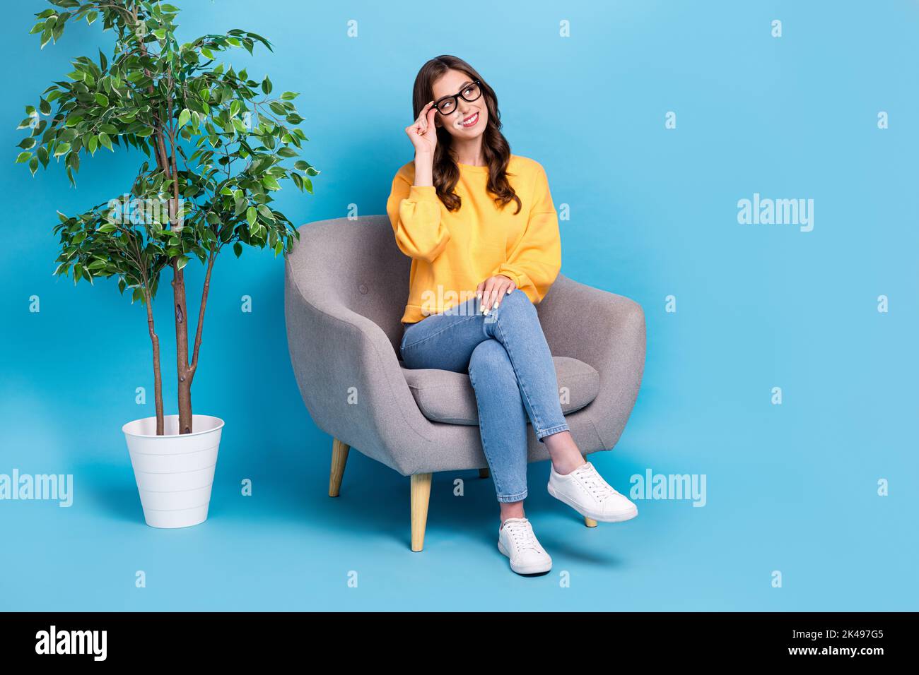 Full size photo of cute young girl sit office room touch specs job ...