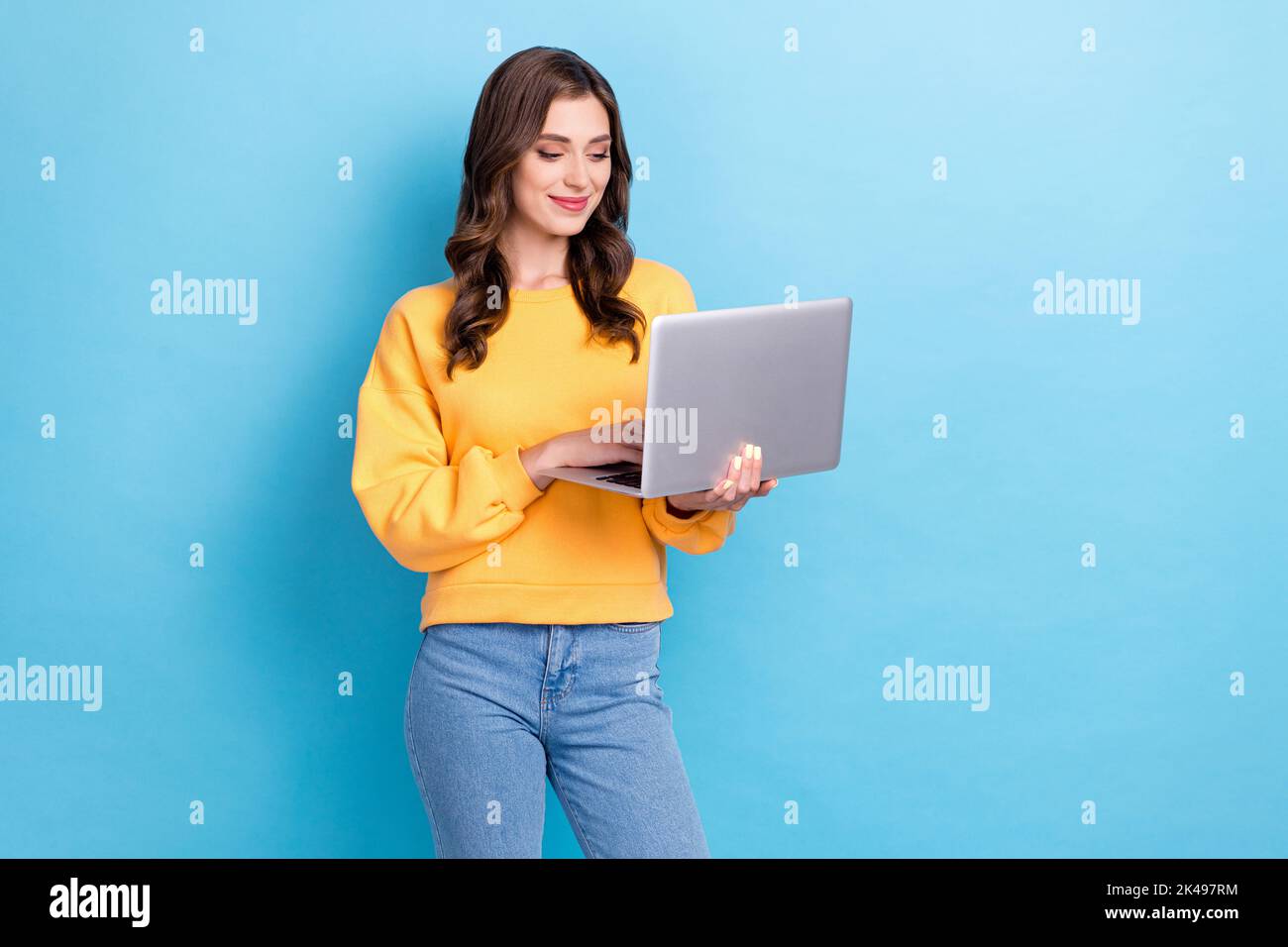 Portrait photo of young adorable pretty positive girl hold laptop ...