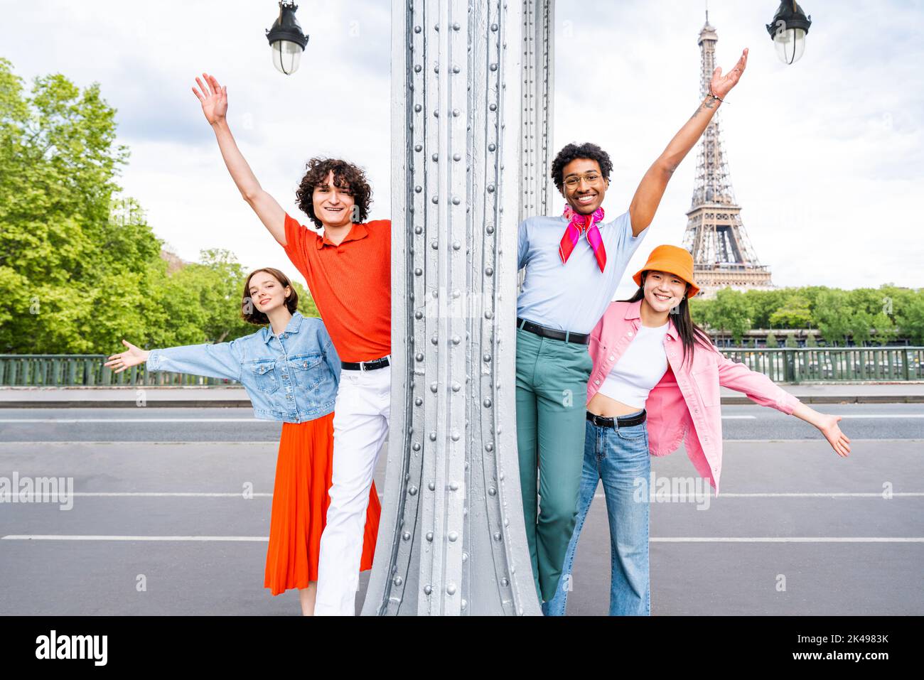 Group of young happy friends visiting Paris and Eiffel Tower, Trocadero ...