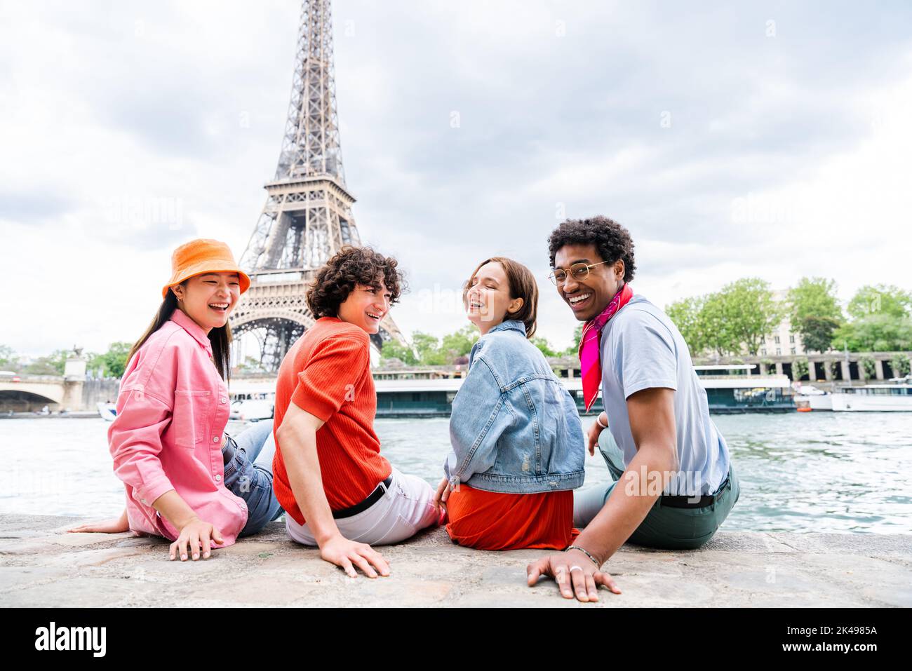 Group of young happy friends visiting Paris and Eiffel Tower, Trocadero ...