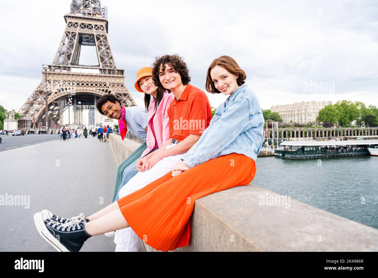 Group of young happy friends visiting Paris and Eiffel Tower, Trocadero ...