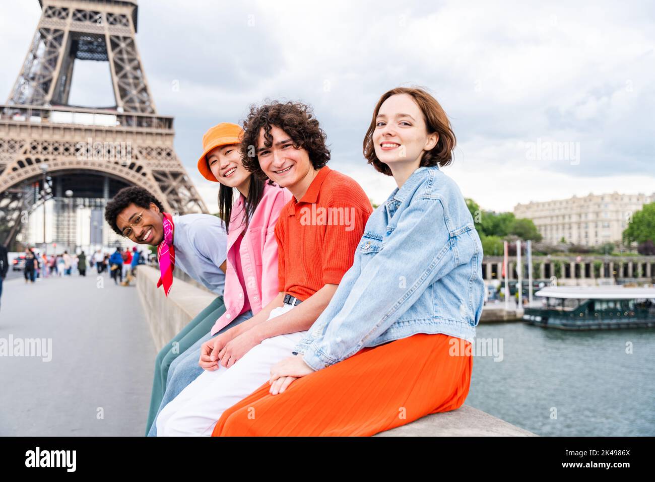 Group of young happy friends visiting Paris and Eiffel Tower, Trocadero ...