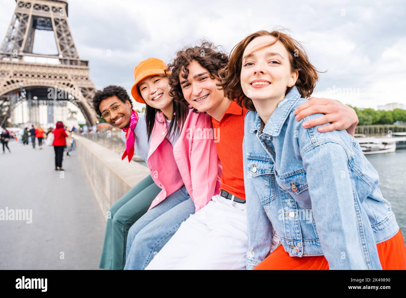 Group of young happy friends visiting Paris and Eiffel Tower, Trocadero ...