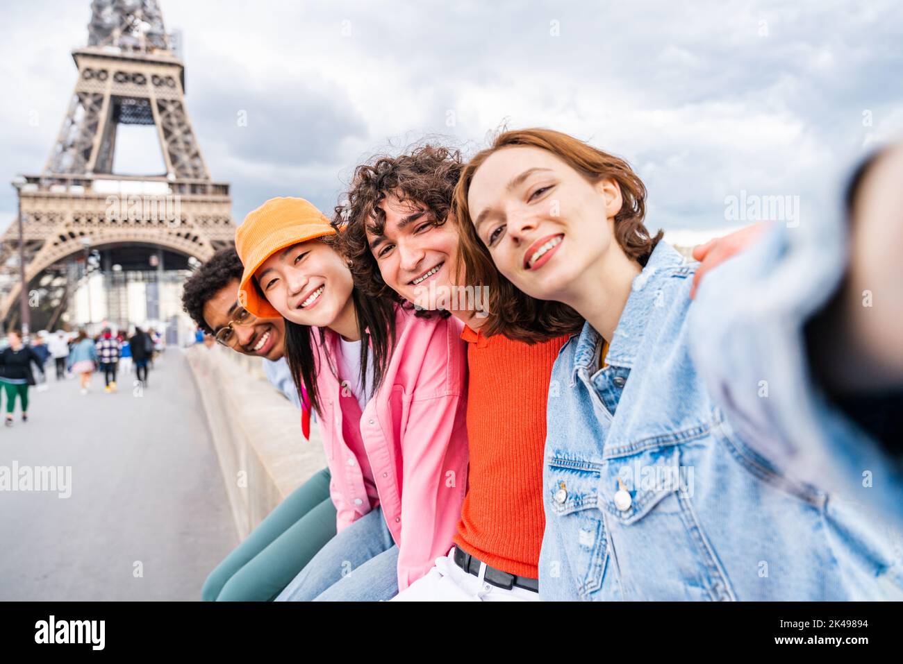 Group of young happy friends visiting Paris and Eiffel Tower, Trocadero ...