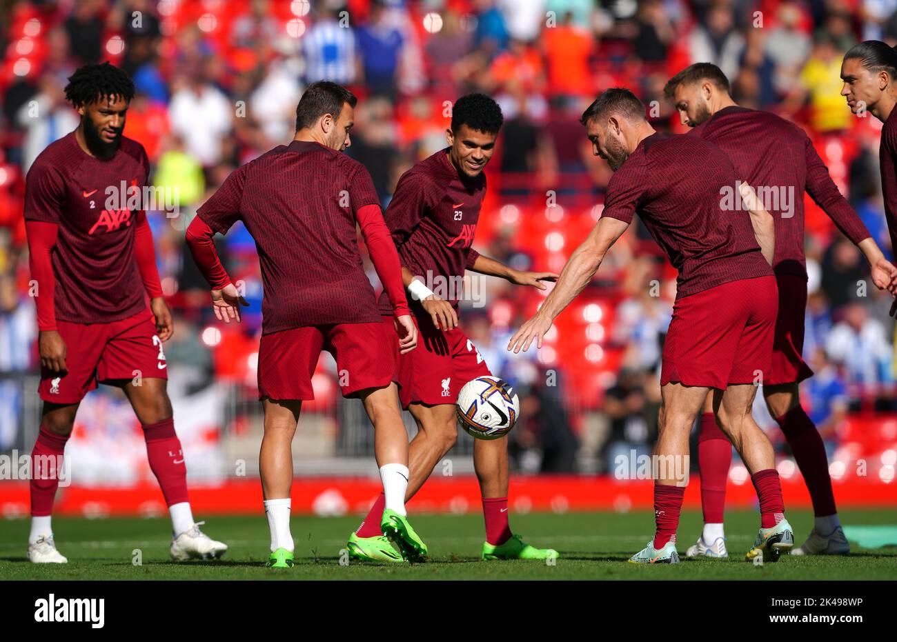 Liverpool's Luis Diaz (centre) warming up before the Premier League ...