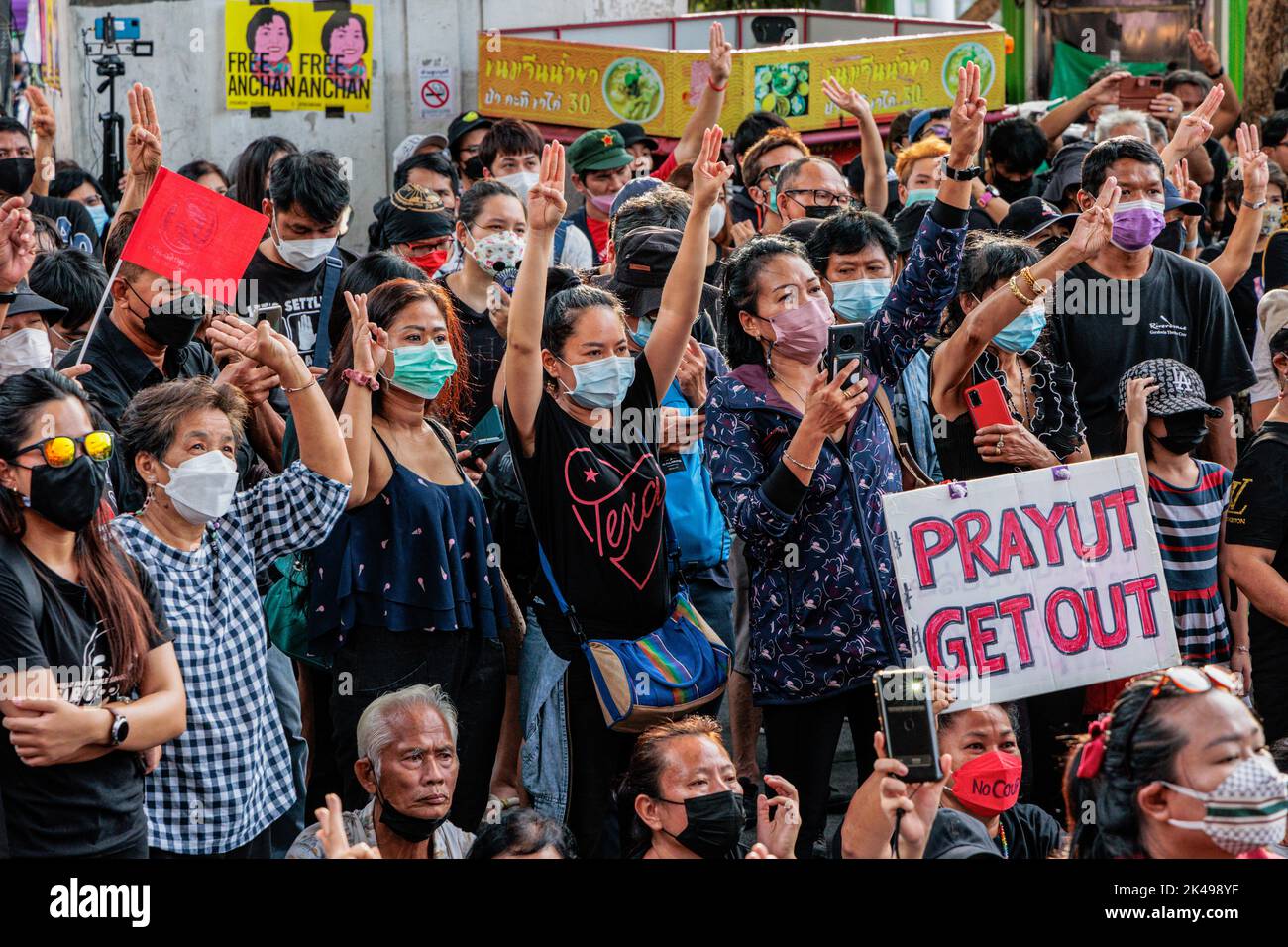 Protesters raise three finger salute during the demonstration. Pro ...