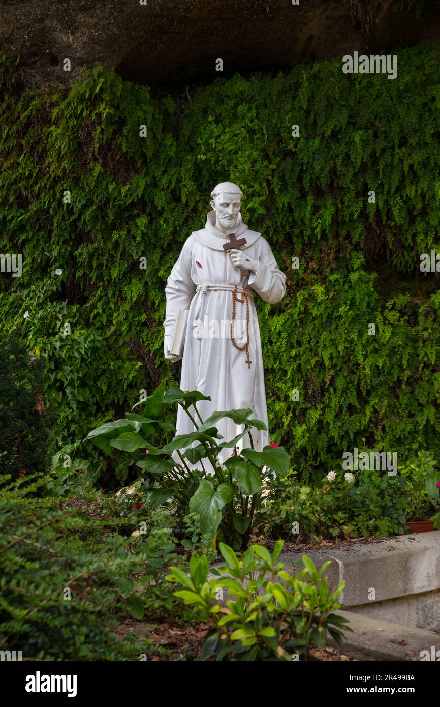 a statue of francis of assisi in france Stock Photo - Alamy