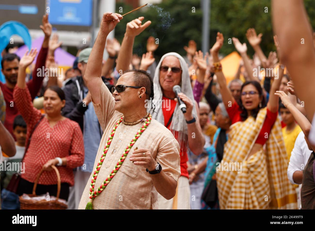 A man lights incense during the Festival of Chariots Parade in Brisbane ...