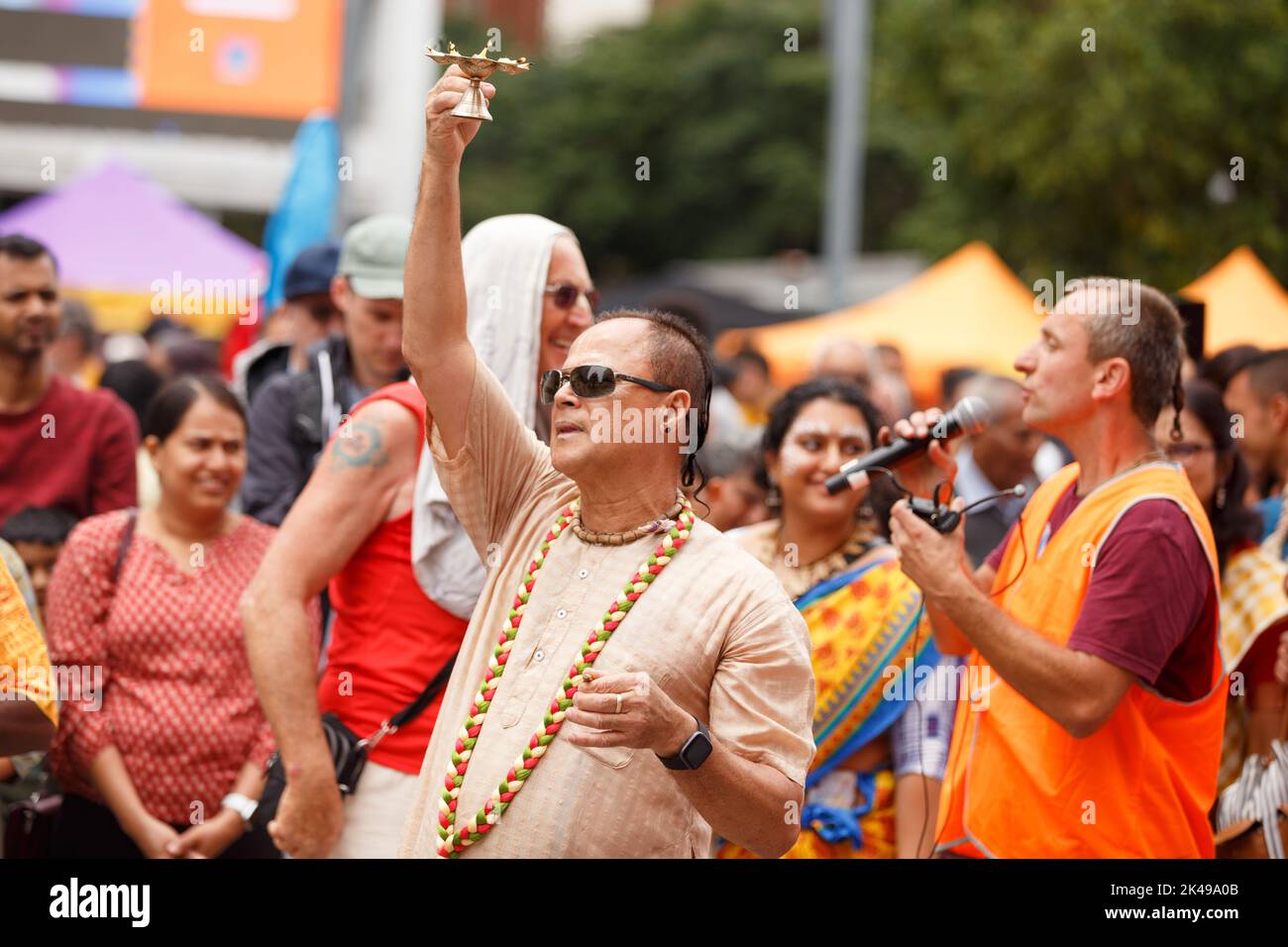 A man lights incense during the Festival of Chariots Parade in Brisbane ...