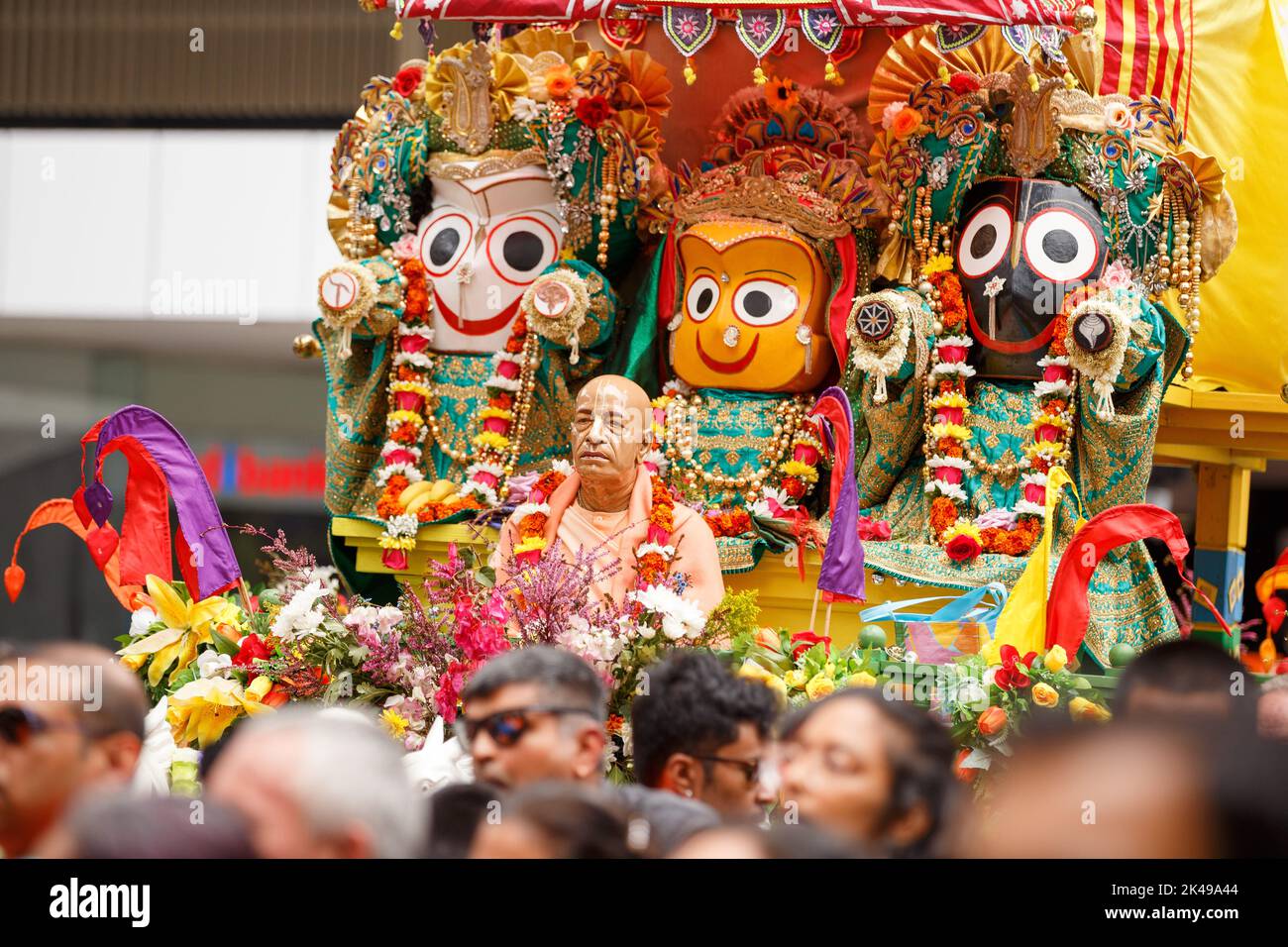 People pull a large adorned chariot during the Festival of Chariots ...