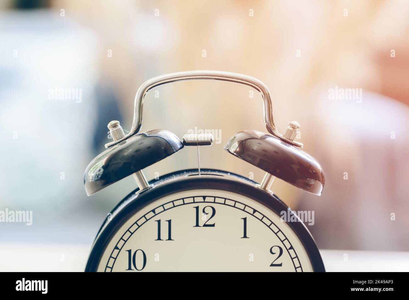 Morning sun. Alarm clock on a beautiful background Stock Photo - Alamy