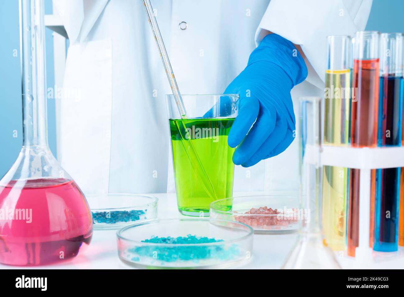 Scientific experiments in a chemistry lab. Color liquids and test tube ...