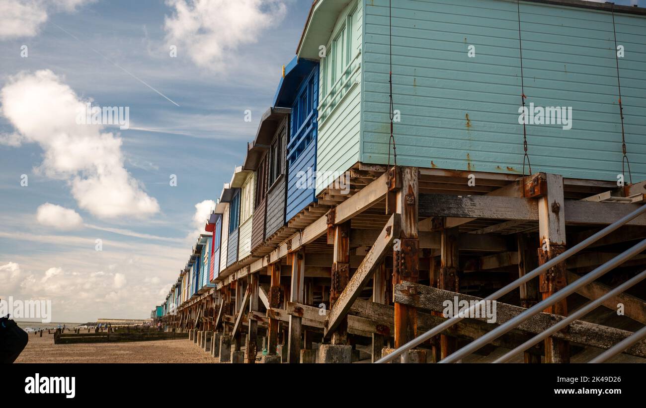 A row of beach huts on the Essex coastline at Frinton-on-Sea in the ...