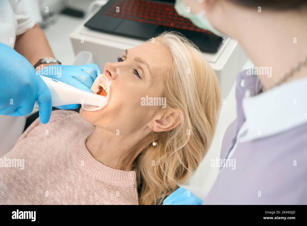 Dentist doing 3d scan of teeth of female person Stock Photo - Alamy
