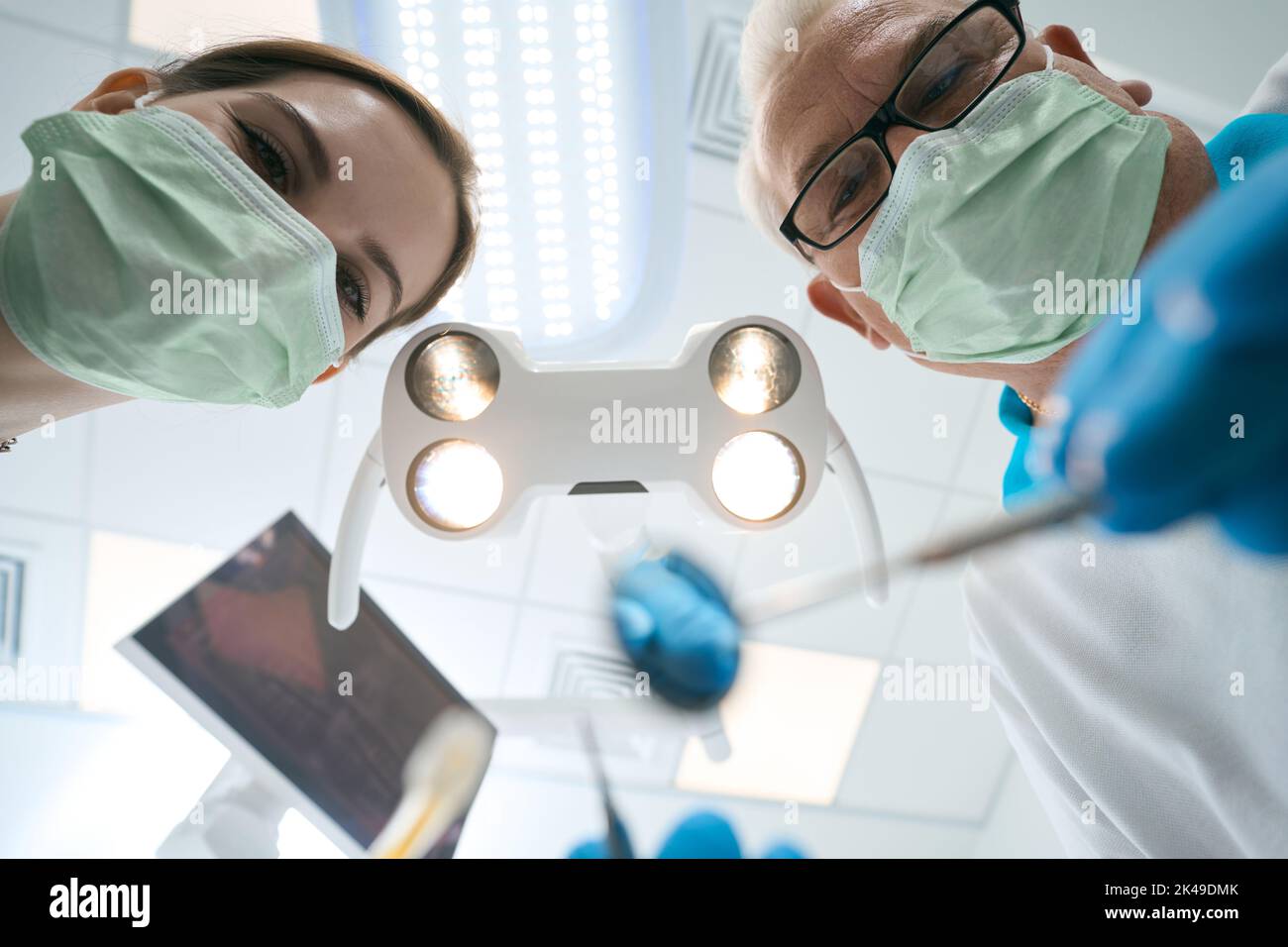 Dentist and nurse making examination of patient Stock Photo - Alamy
