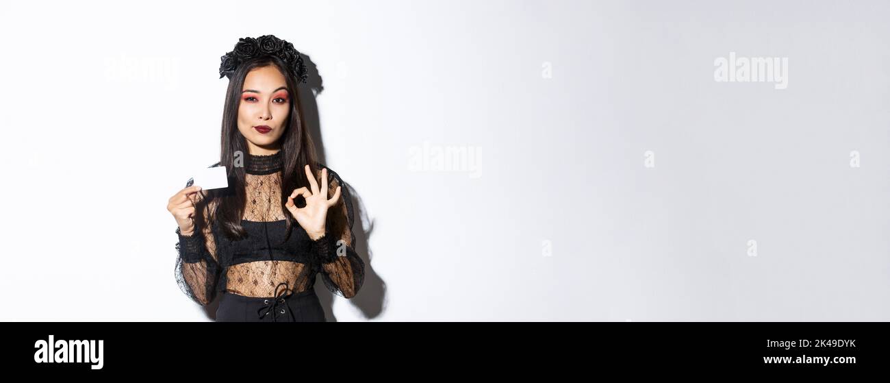 Portrait of confident asian woman assuring you in something, wearing ...