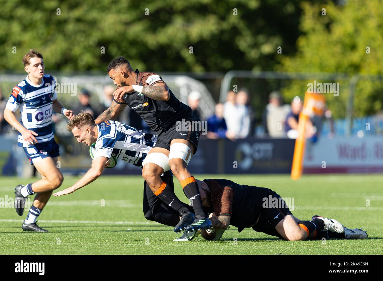 Louis Brown of Coventry Rugby is tackled by Bobby De Wee of Ealing ...
