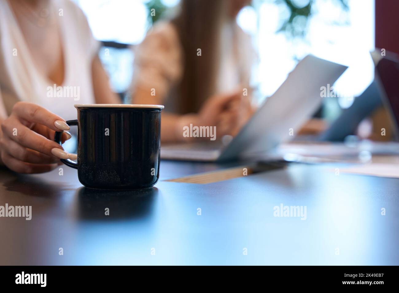 Company employees using portable computers in workplace Stock Photo - Alamy