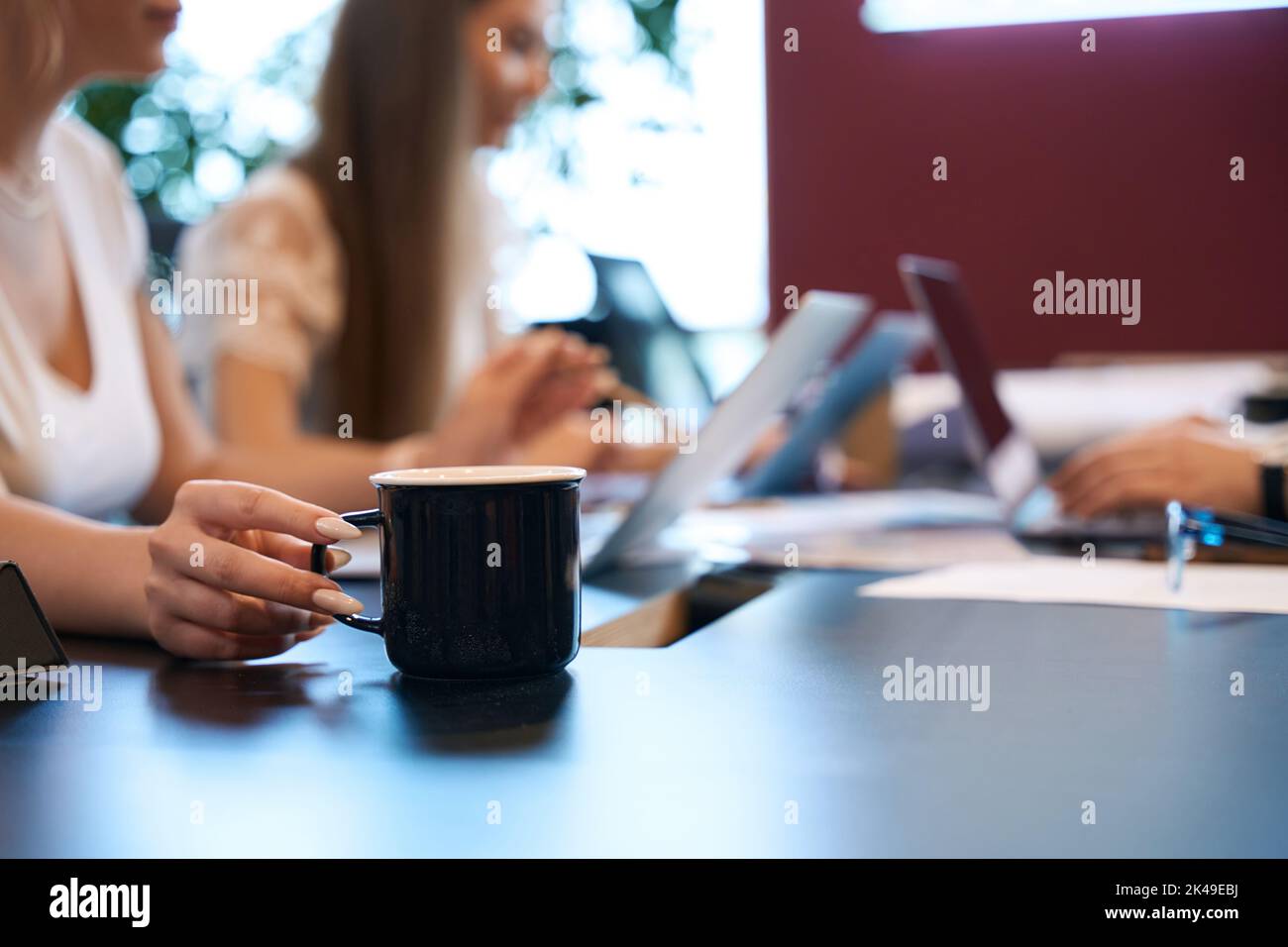 Office workers using portable computers during coffee break Stock Photo ...