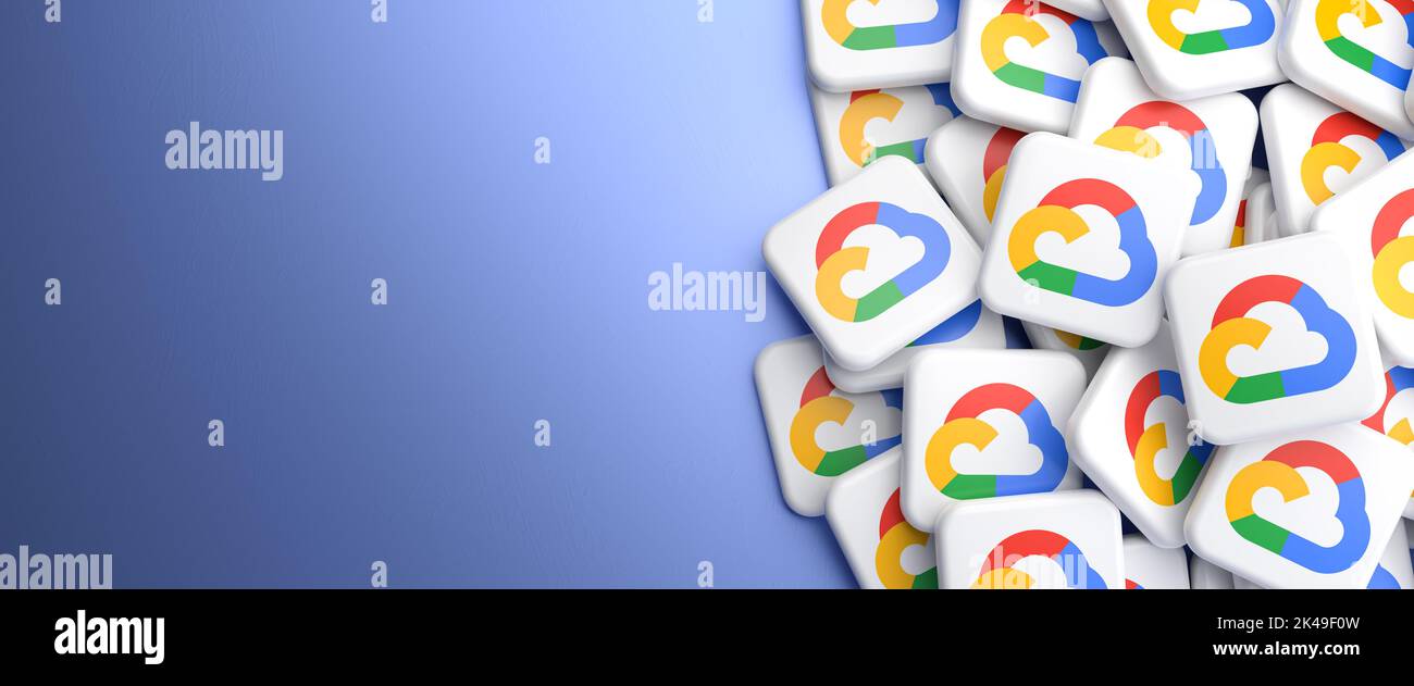 Logos of the Google Cloud services on a heap on a table. Web banner ...