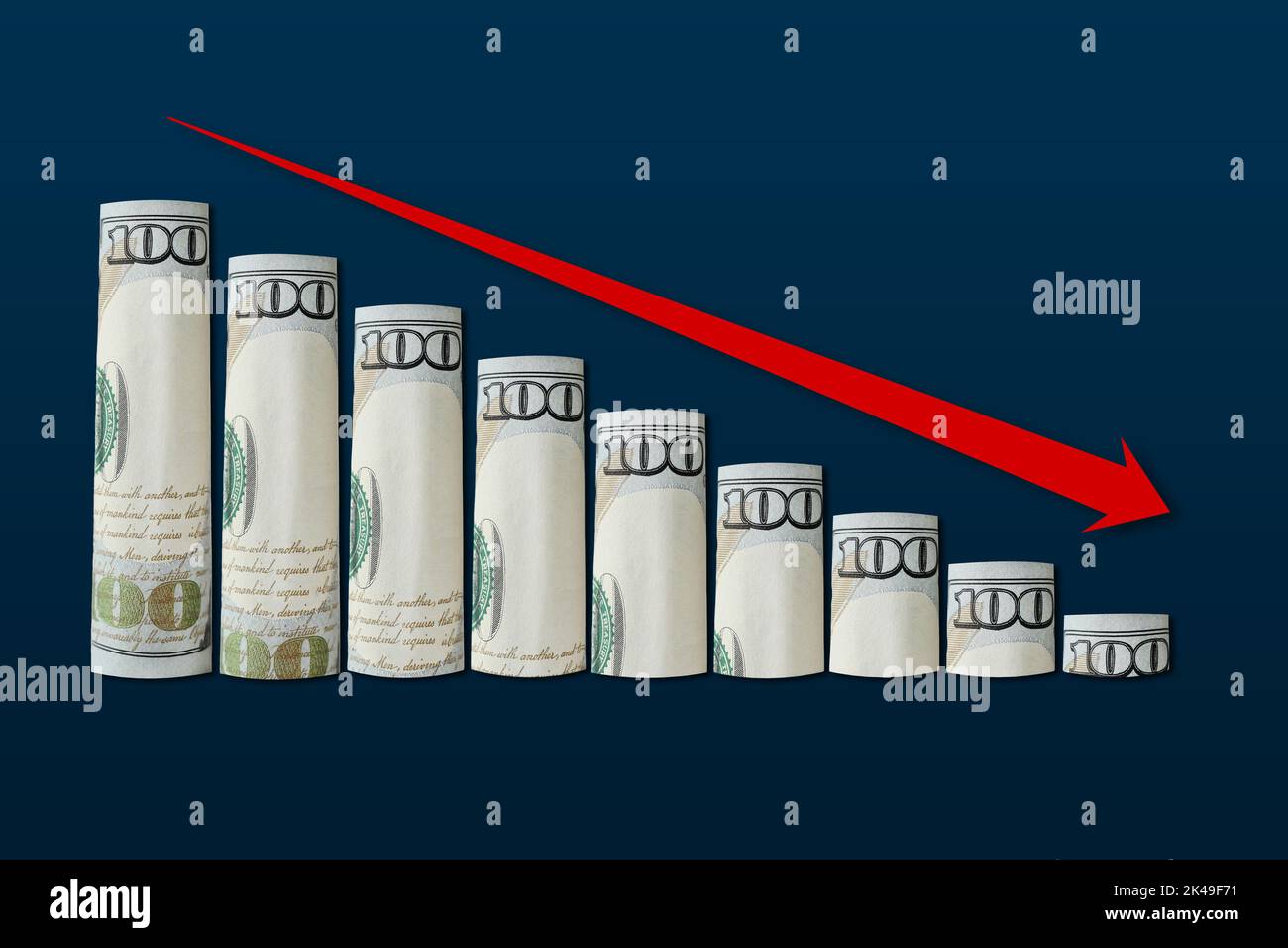 Rolled up dollar bills falling graph with red down arrow. Business ...