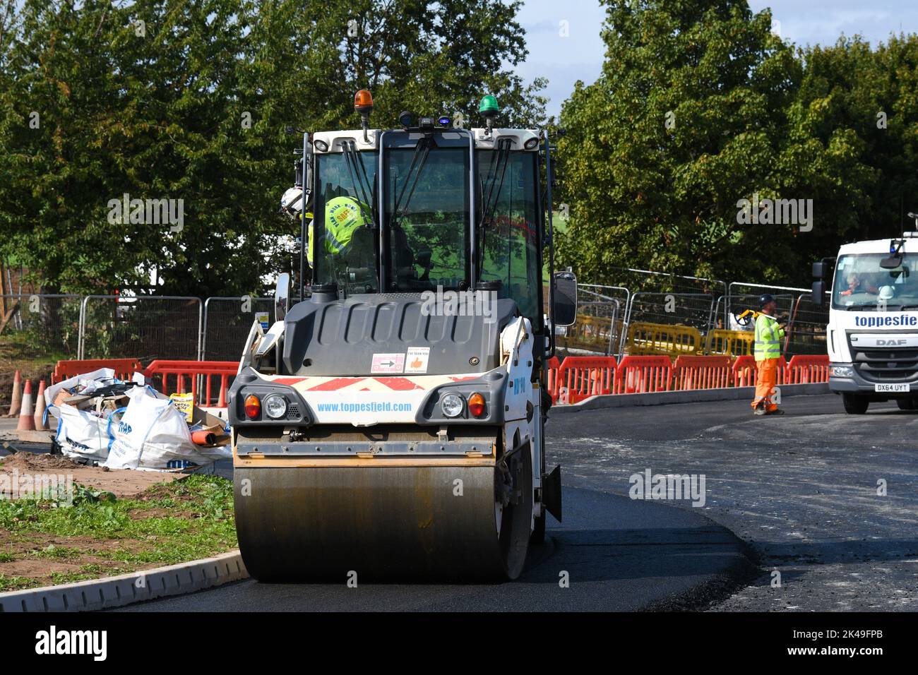 road roller rolling tarmac on a new road Stock Photo - Alamy