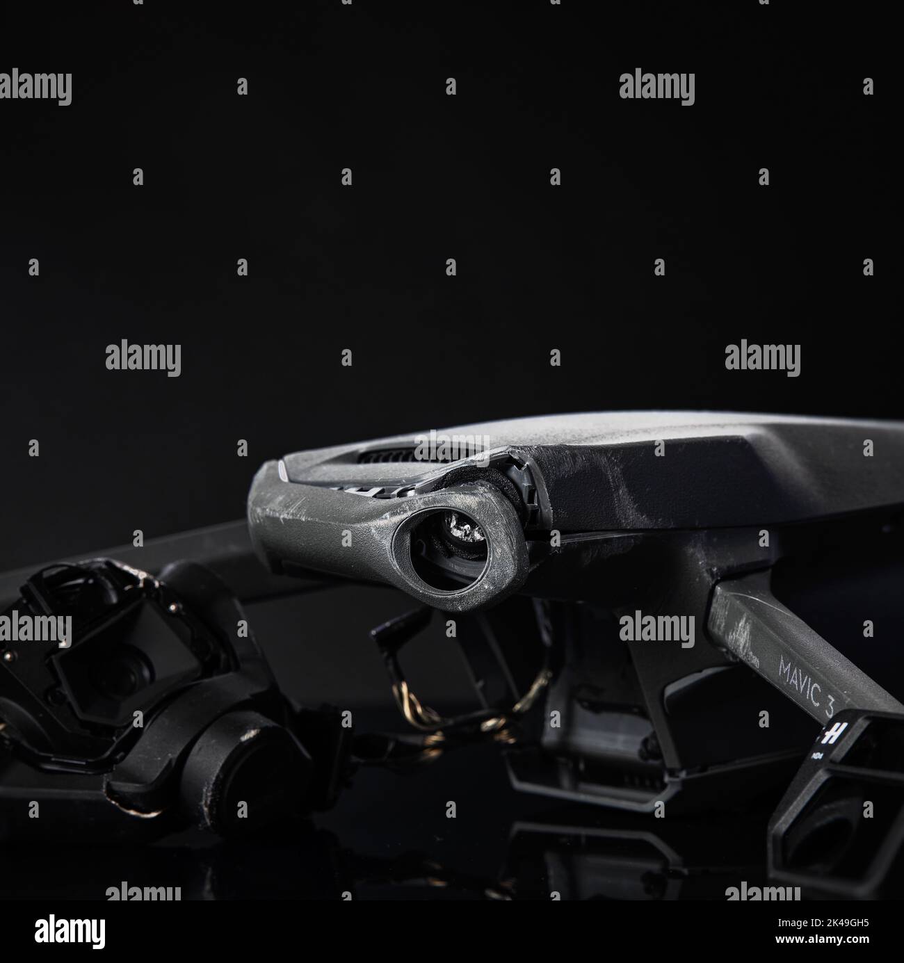 Drone DJI Mavic 3 after crashed on a black background. Drone after ...