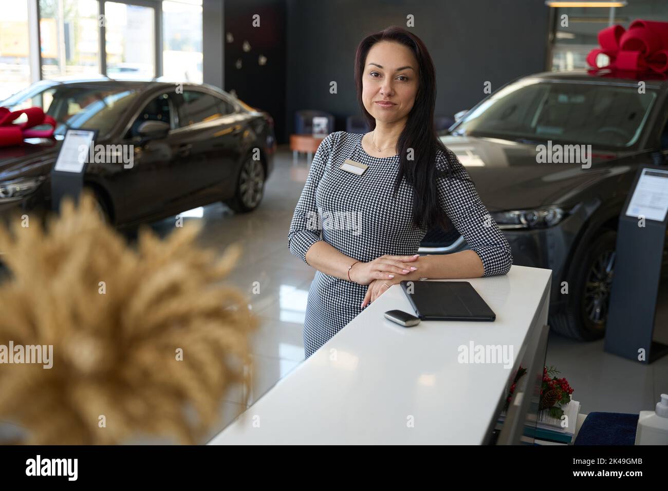 Car service young manager stands hi-res stock photography and images ...