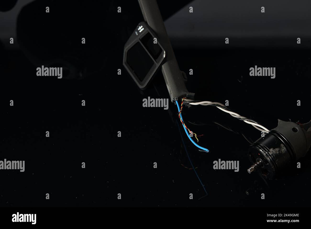 Drone DJI Mavic 3 after crashed on a black background. Drone after ...