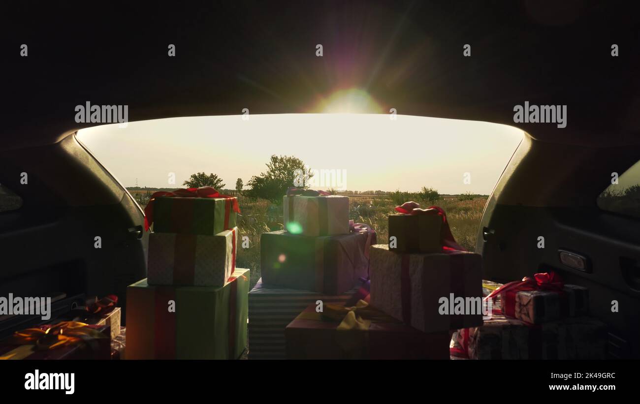 gift boxes in the car. many beautifully wrapped boxes, lie in the car ...