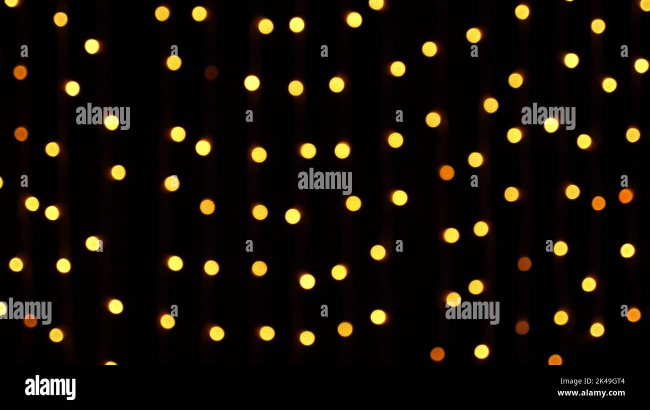 Abstract bokeh background in motion. shining, blurred golden particles, lights. bright bokeh ...