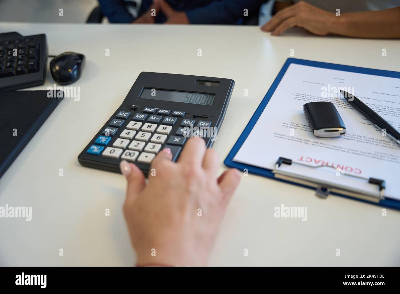 Happy family using calculator hi-res stock photography and images - Alamy