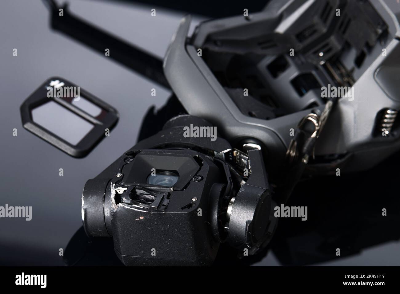 Drone DJI Mavic 3 after crashed on a black background. Drone after ...