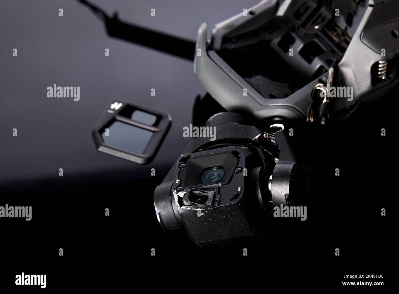 Drone DJI Mavic 3 after crashed on a black background. Drone after ...