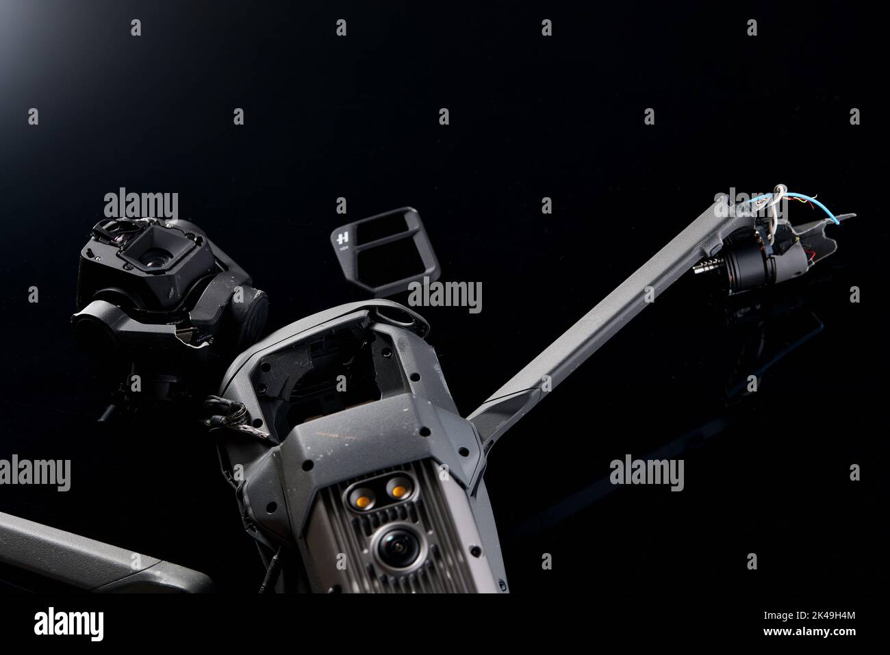 Drone DJI Mavic 3 after crashed on a black background. Drone after ...