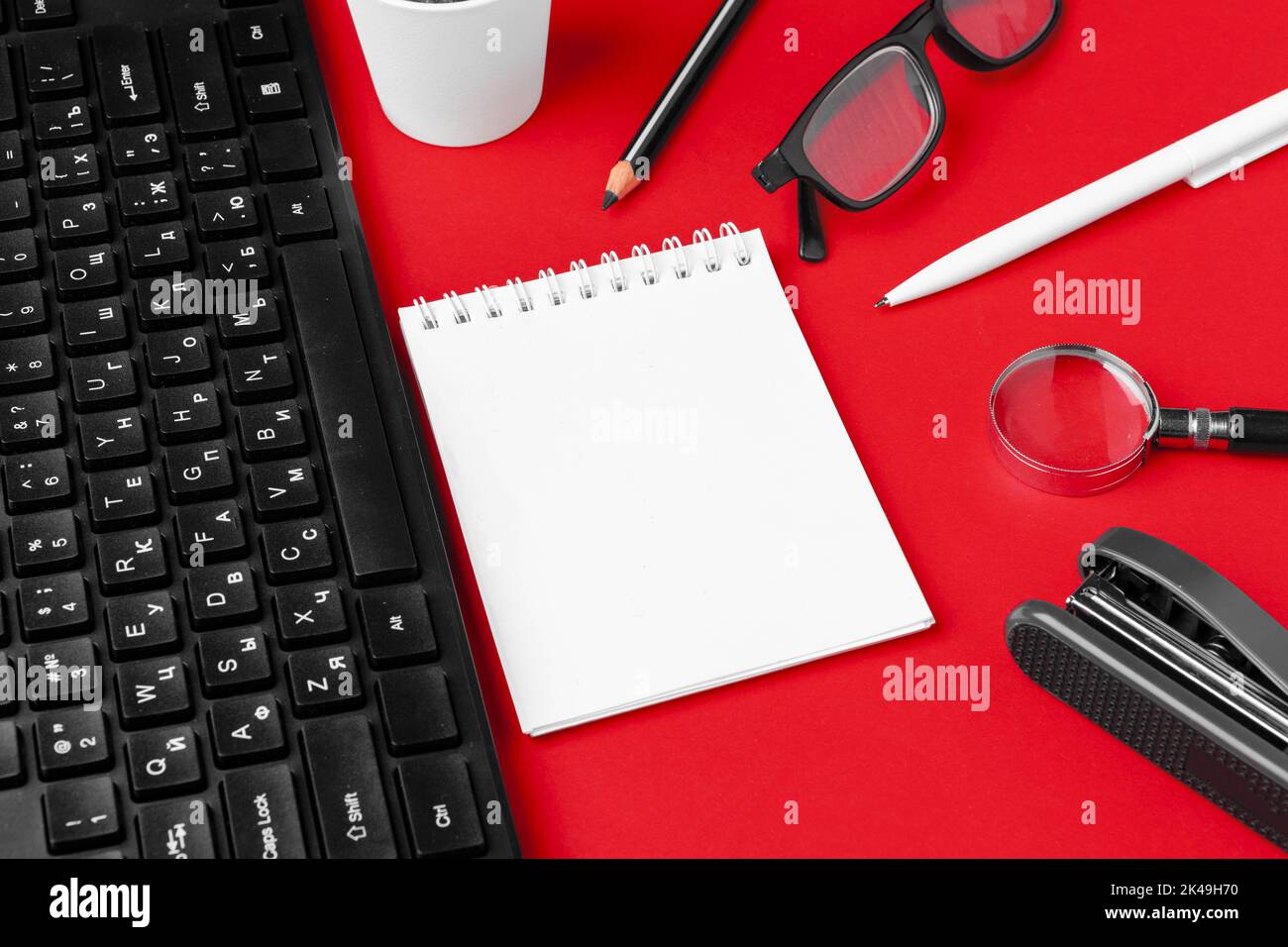 Set of stationery items on red office desk Stock Photo - Alamy