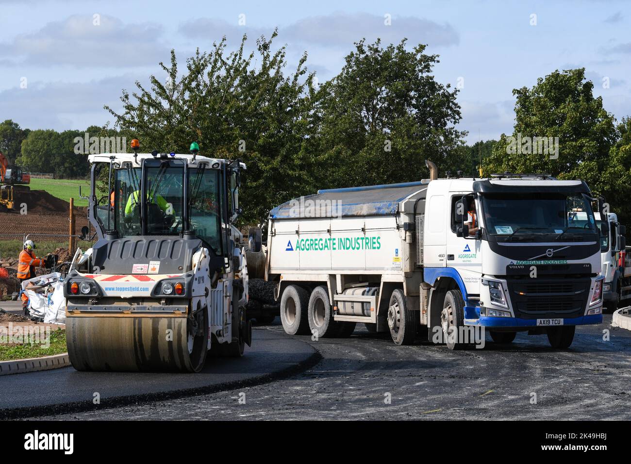 road roller rolling tarmac on a new road Stock Photo - Alamy
