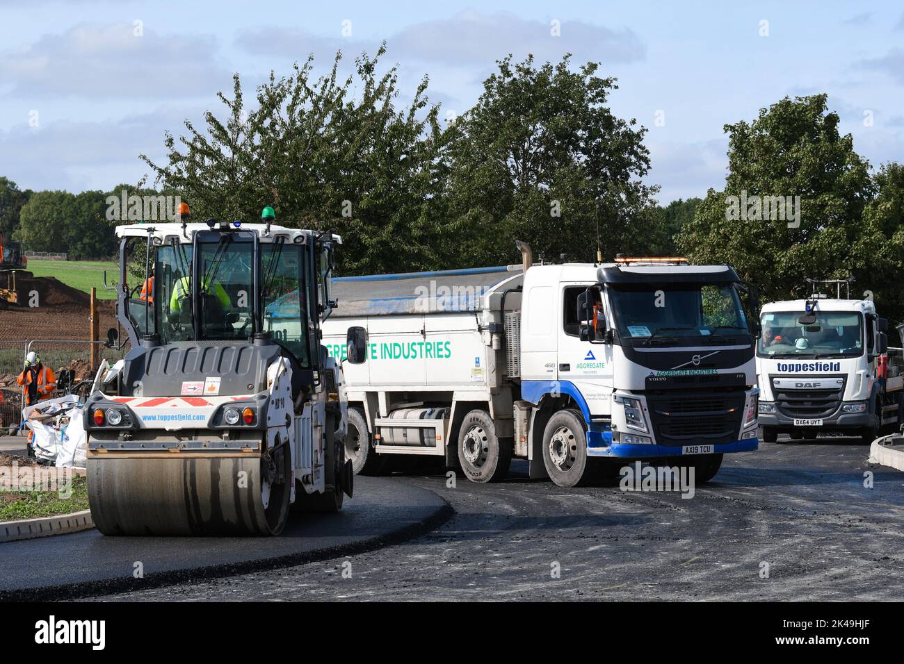 road roller rolling tarmac on a new road Stock Photo - Alamy