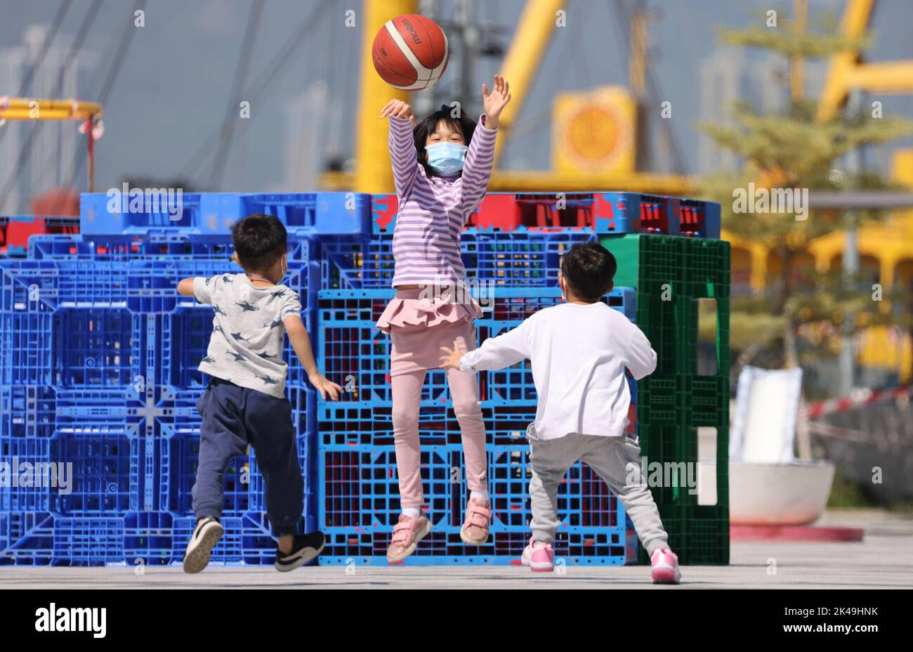 Kids enjoy outdoor activities with parents in sunny weather at Belcher ...
