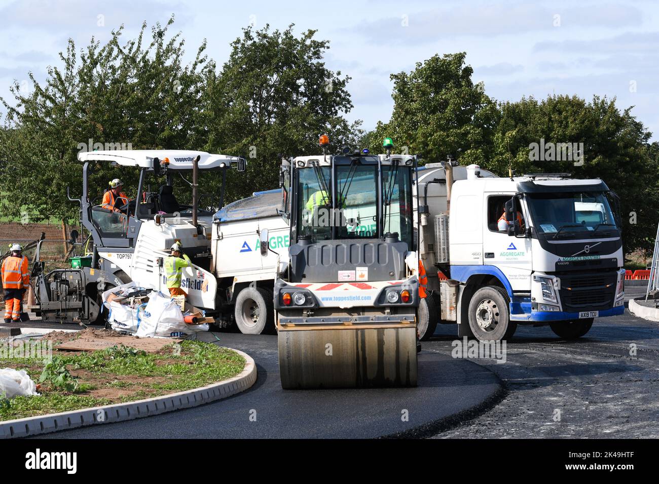 asphalt paver laying tarmac on a new road Stock Photo - Alamy