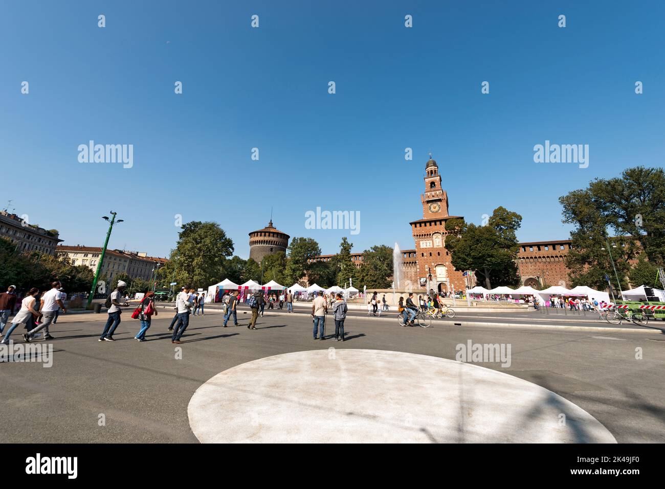 People walking in the square in front of the Sforza Castle XV century ...