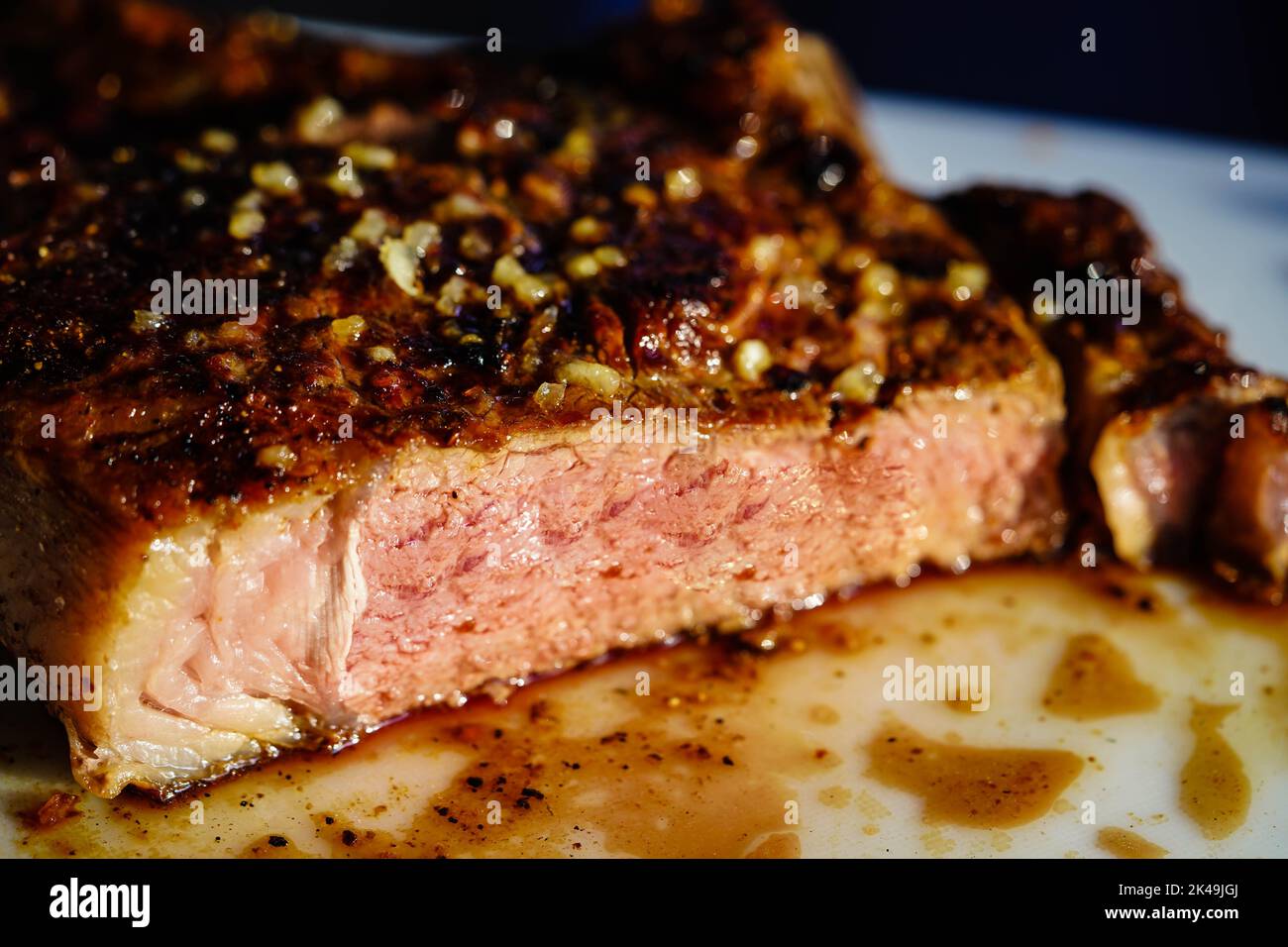 Tomahawk steak with herbs and spices Stock Photo - Alamy