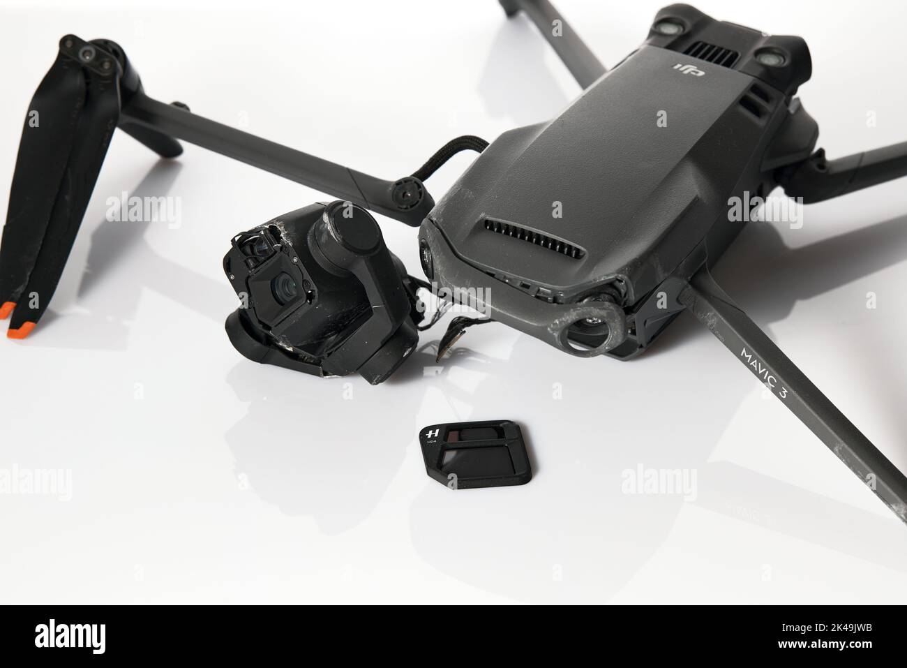 Drone DJI Mavic 3 after crashed on a white background. Drone after ...