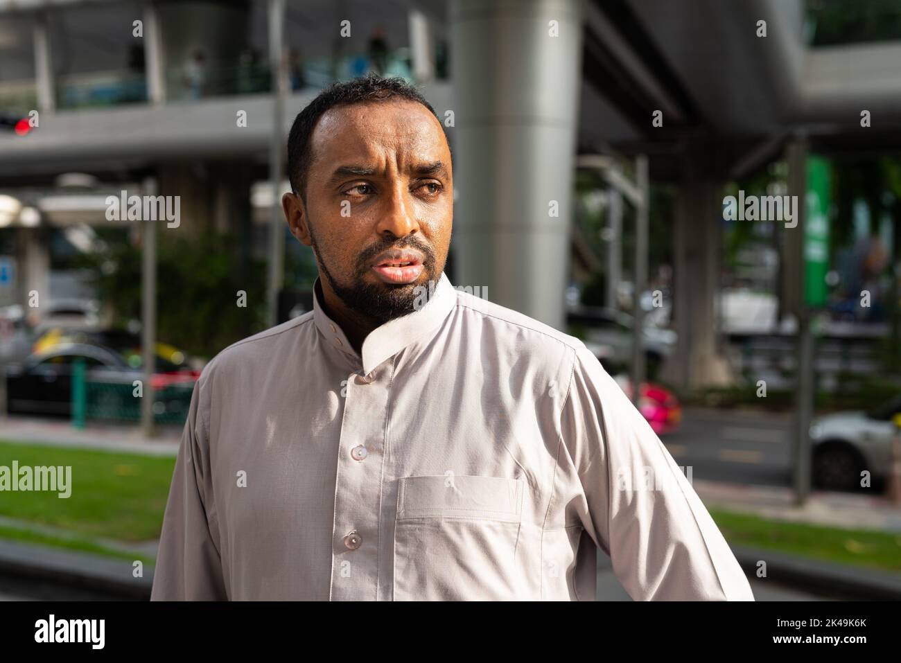 Portrait of black man in city wearing traditional clothes Stock Photo ...