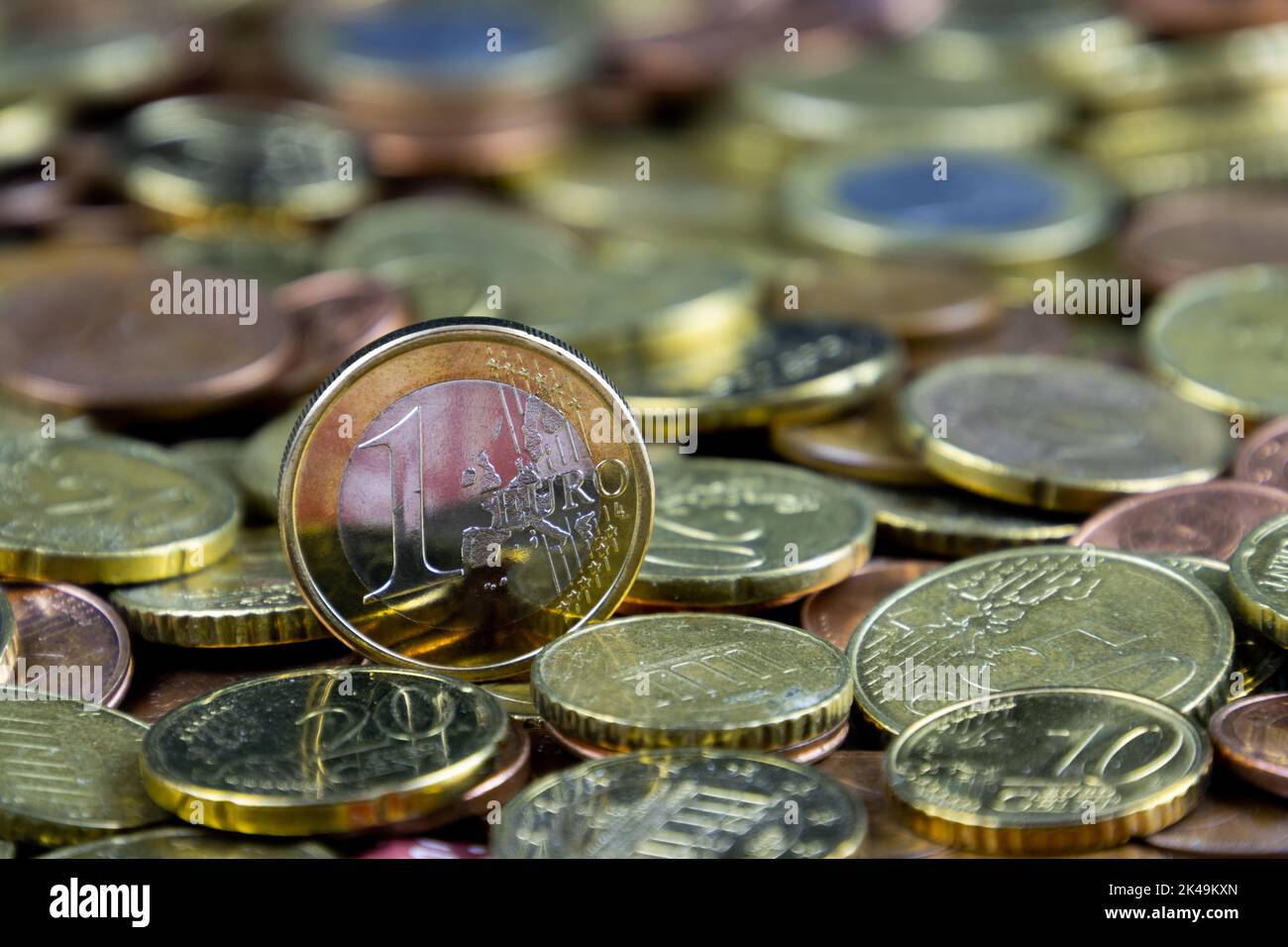 Many euro coins for financial background with focus on 1 euro coin ...