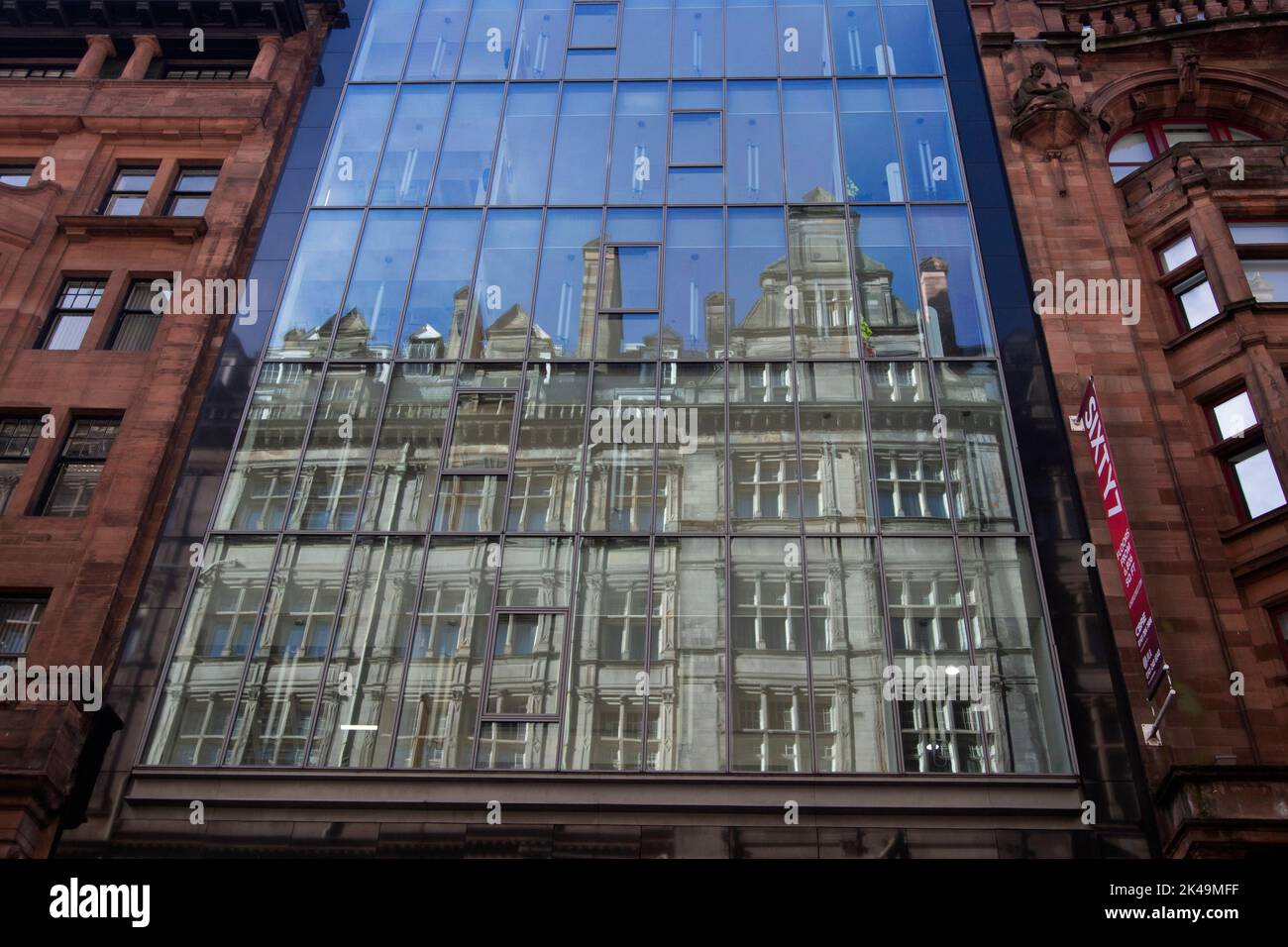 The Central Station Hotel reflected in the glass facade of the Sixty7 ...