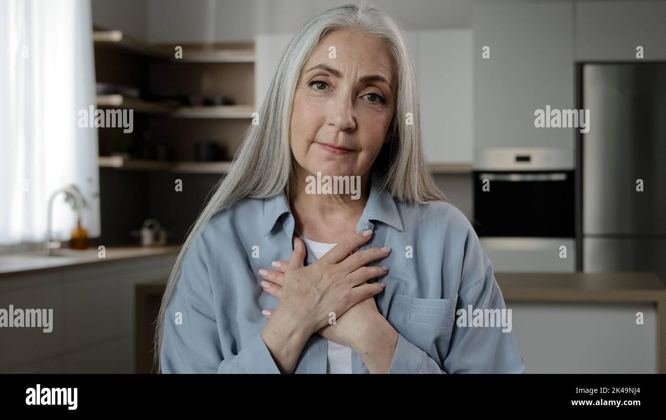 Hands folded to chest hi-res stock photography and images - Alamy