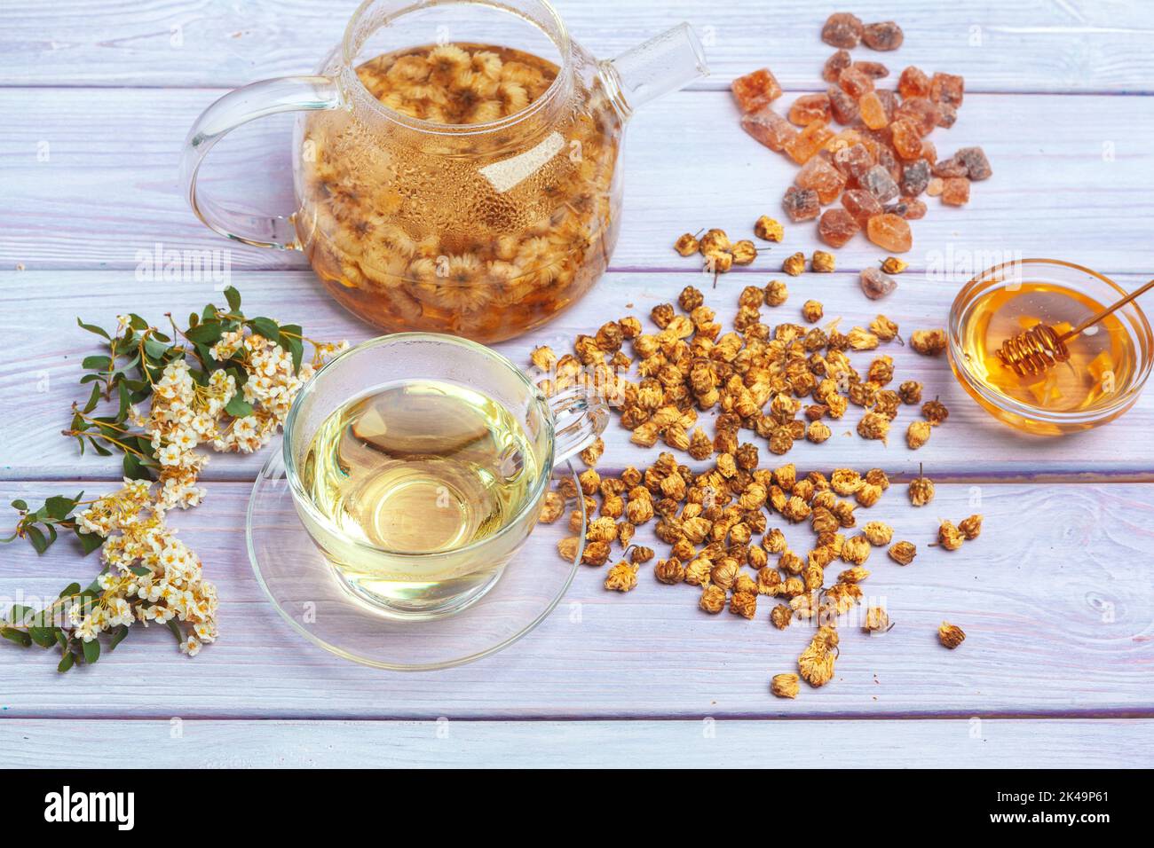 Healthy chamomile tea in glass cup. Teapot, small honey jar Stock Photo ...